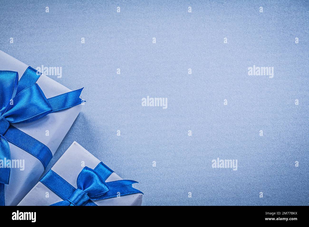 Packaged present boxes on blue background greeting card holidays ...