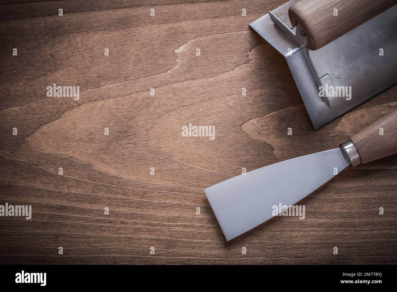 paint scraper and surfacer with wooden handles Stock Photo - Alamy