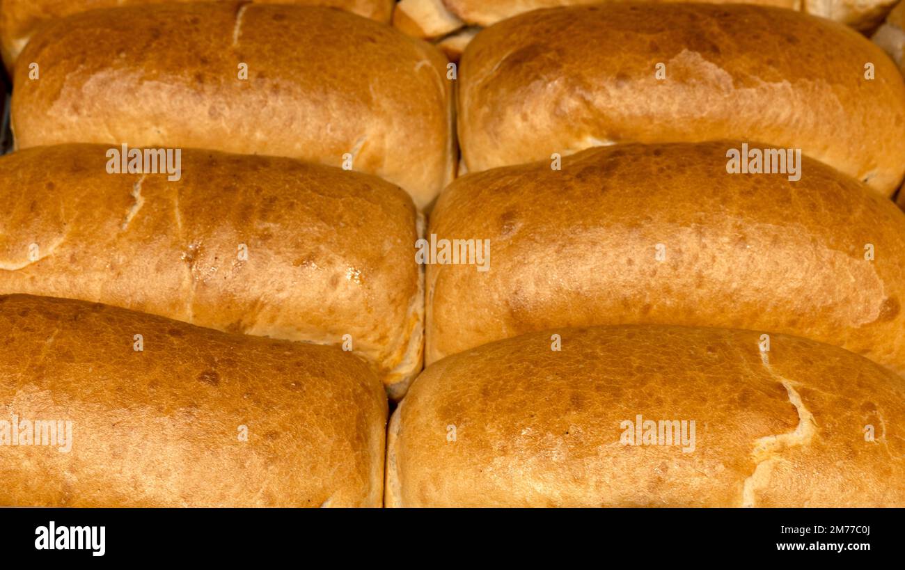 Loaves of fresh bread. background of bread close-up. bread on the ...