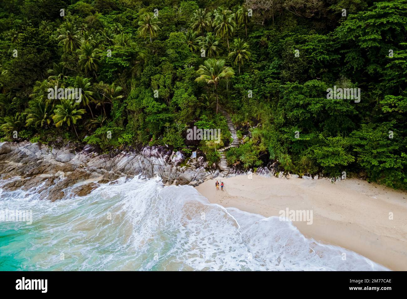Drone aerial view at couple on the beach at Freedom beach in Phuket ...