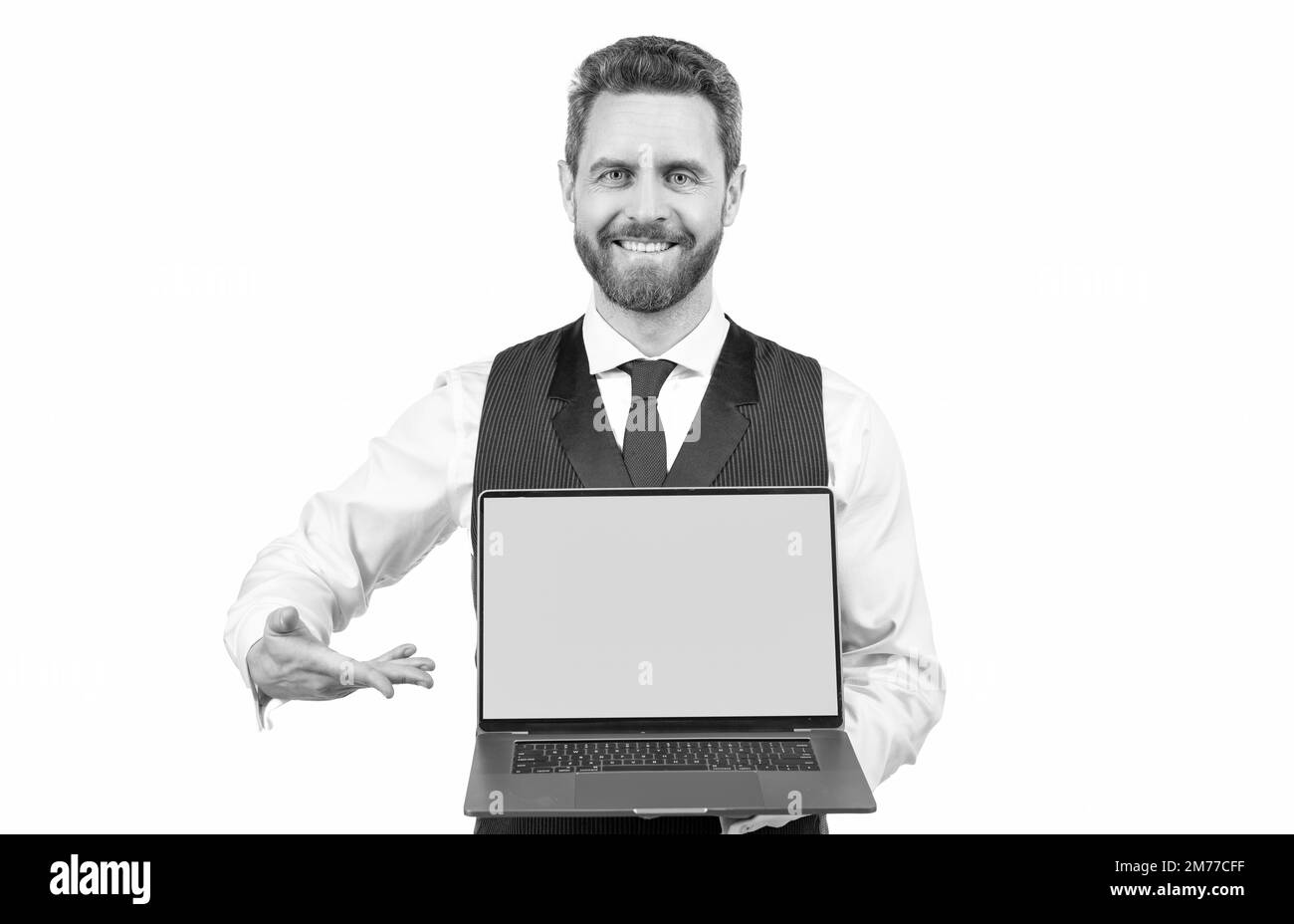 happy businessman presenting computer with green screen for copy space ...