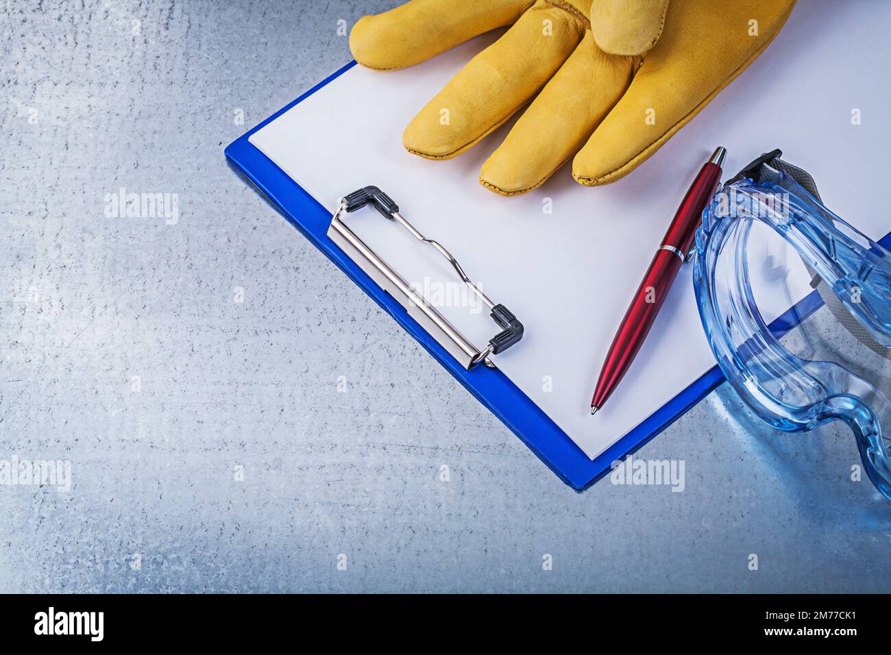 Plastic glasses protective gloves notepad pen on metallic background ...