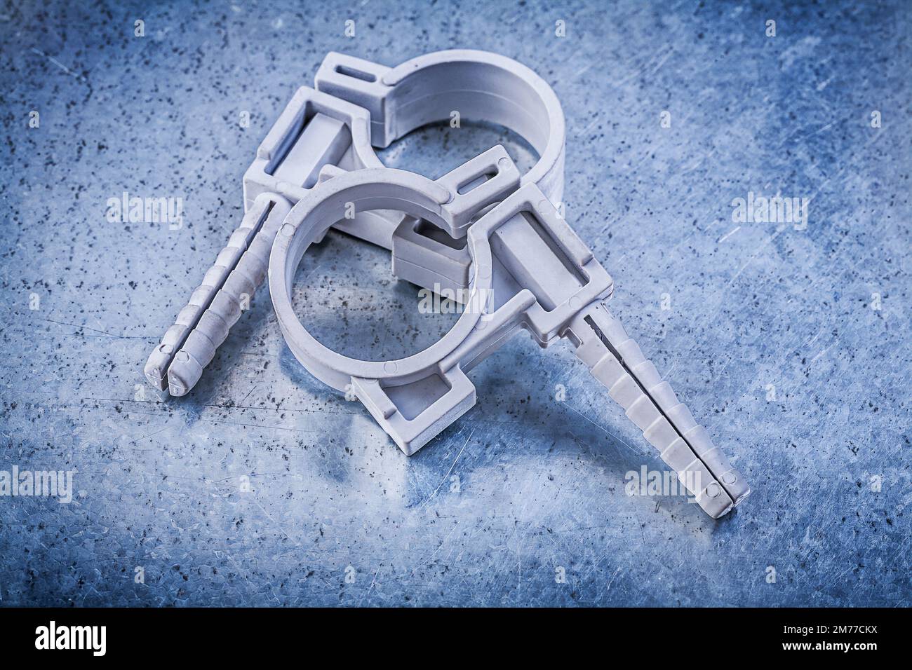 Plastic pipe fixtures on metallic background construction concept Stock ...