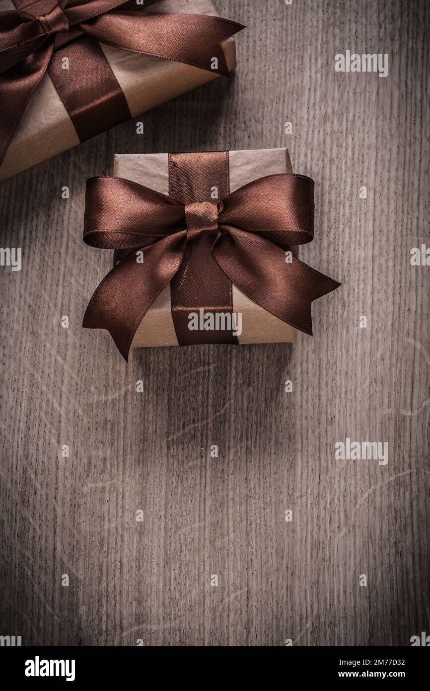 Present boxes with brown ribbons vertical version celebration concept ...