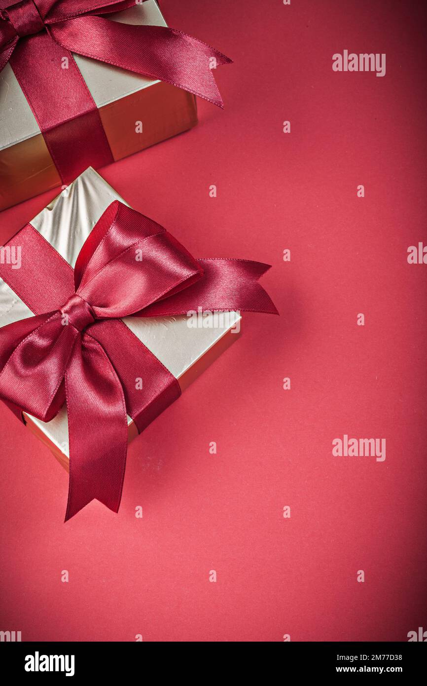 Present boxes on red background vertical view holidays concept Stock ...