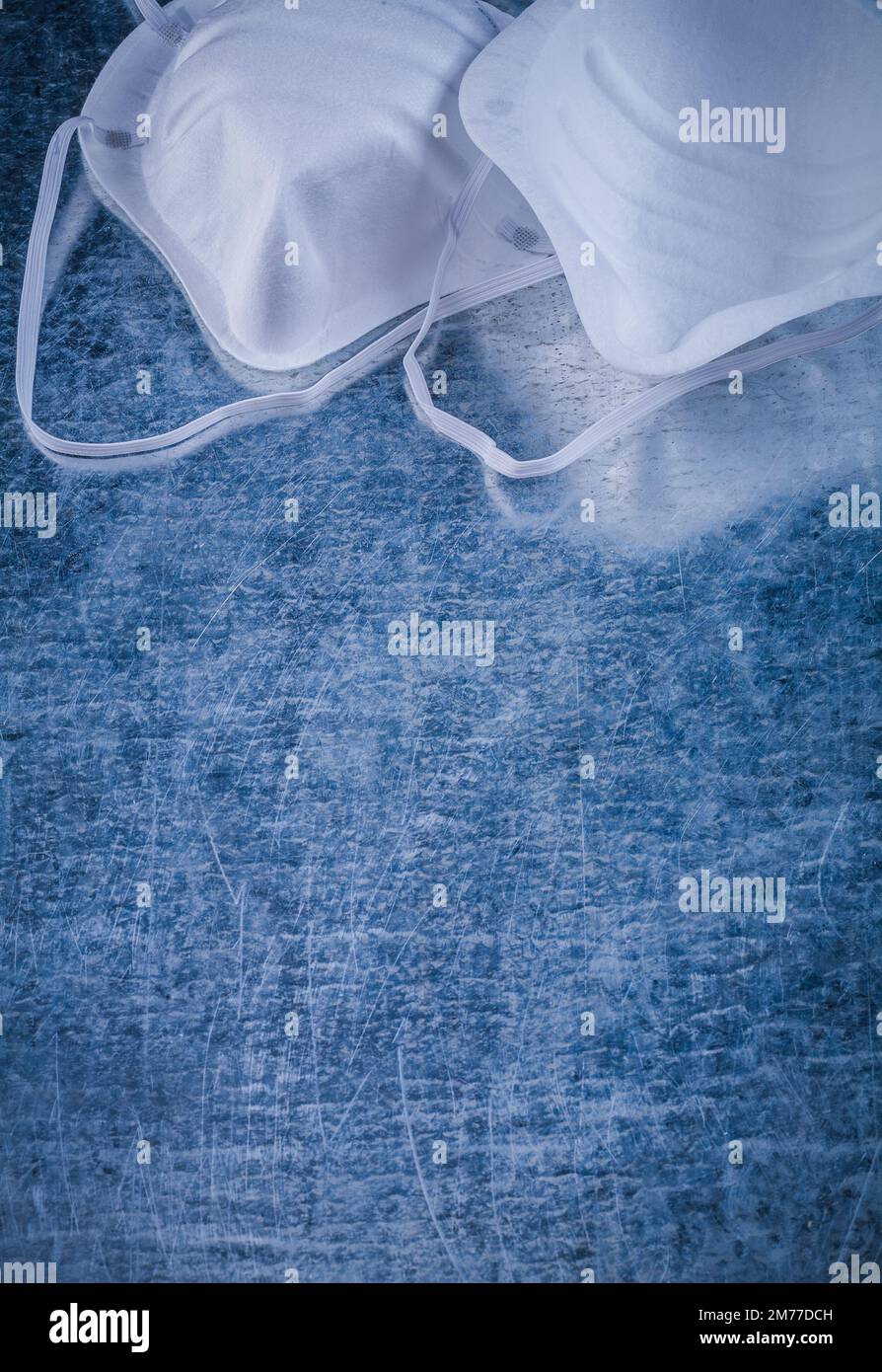 Protective respiratory mask on metallic surface construction concept ...