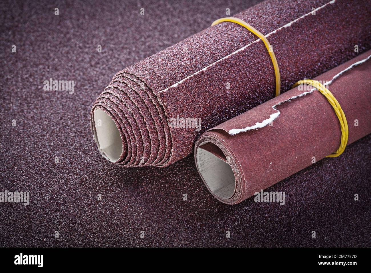 Rolled up sand paper top view abrasive tools Stock Photo - Alamy