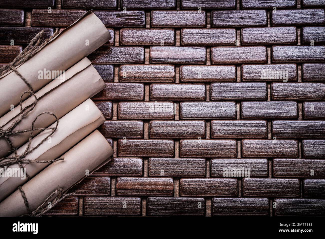 Rolled vintage documents on wicker wooden matting copyspace Stock Photo ...