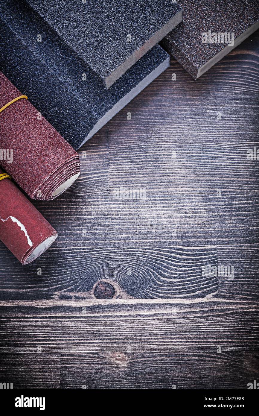 Rolls of abrasive paper sponges on vintage wood board Stock Photo - Alamy