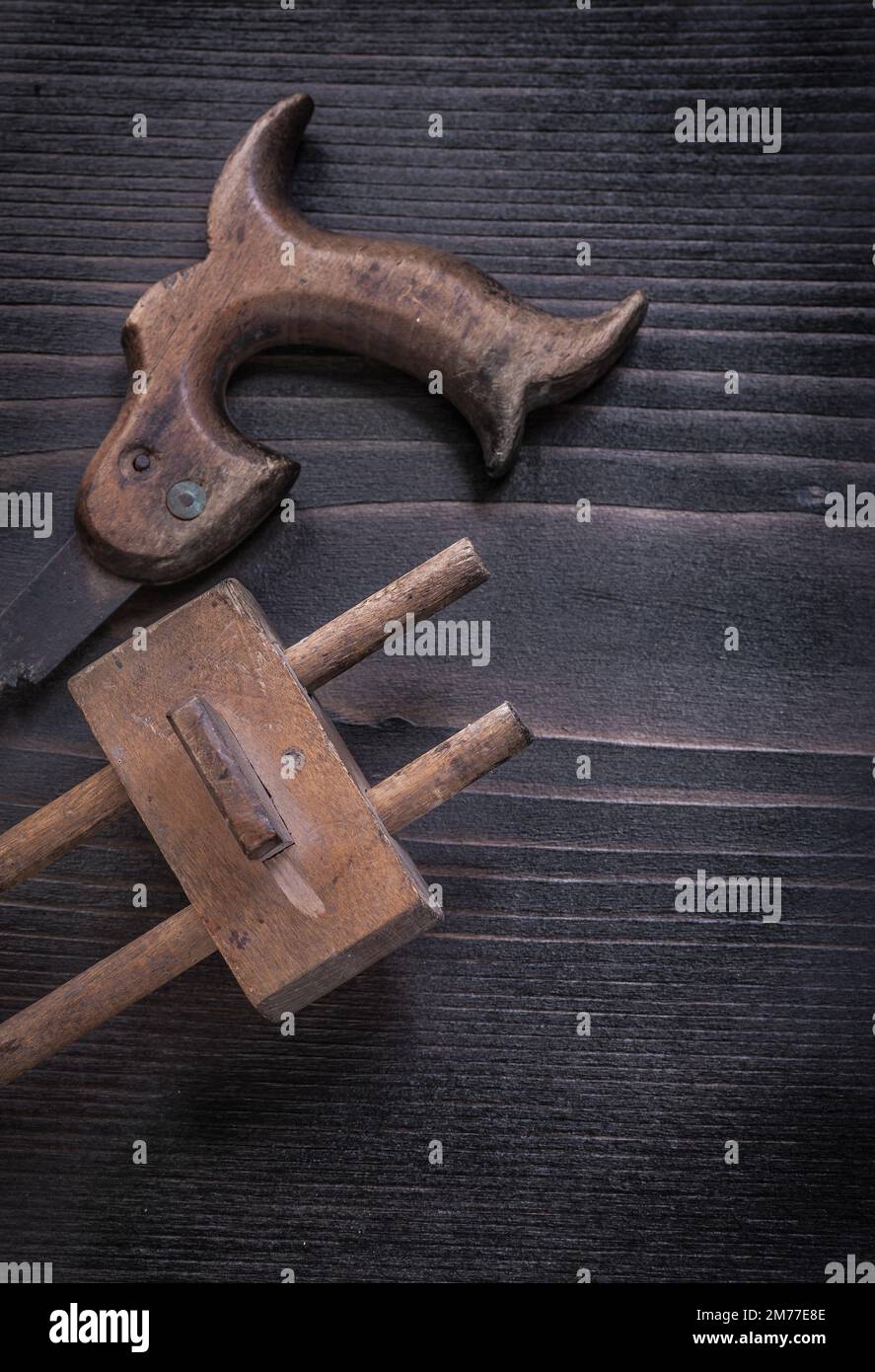 Rough rusted hand saw vintage wooden marking gage Stock Photo - Alamy
