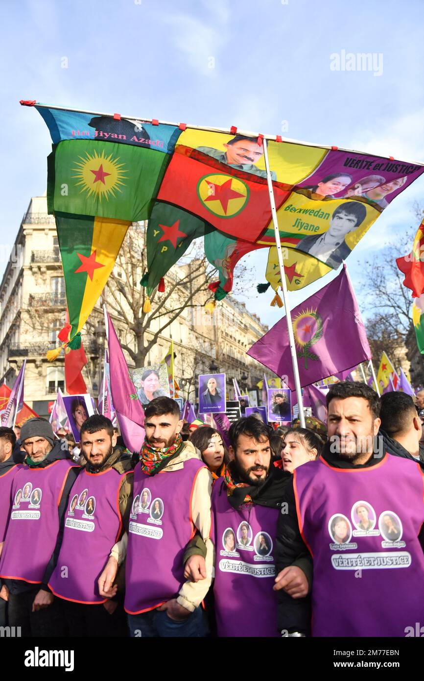People take part in a tribute march in the memory of three Kurdish ...