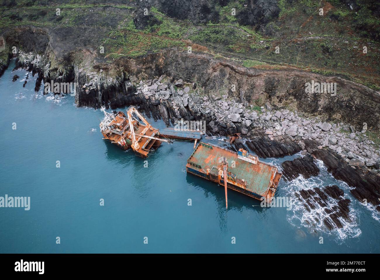 A drone view of the rusty ghost ships divided into two parts near the ...