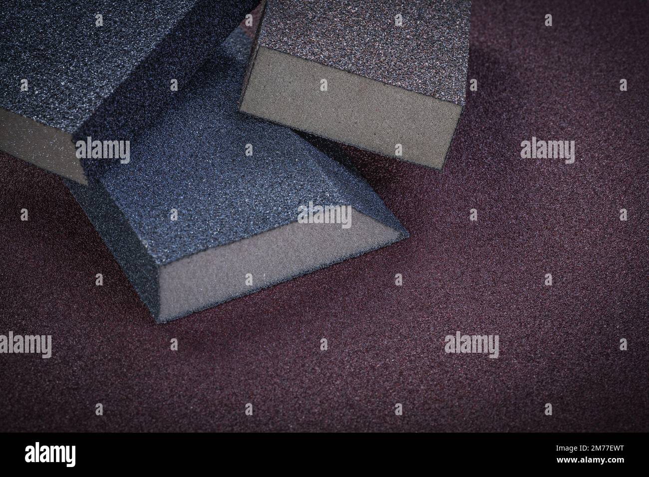 Sanding sponges on emery paper top view abrasive tools Stock Photo - Alamy