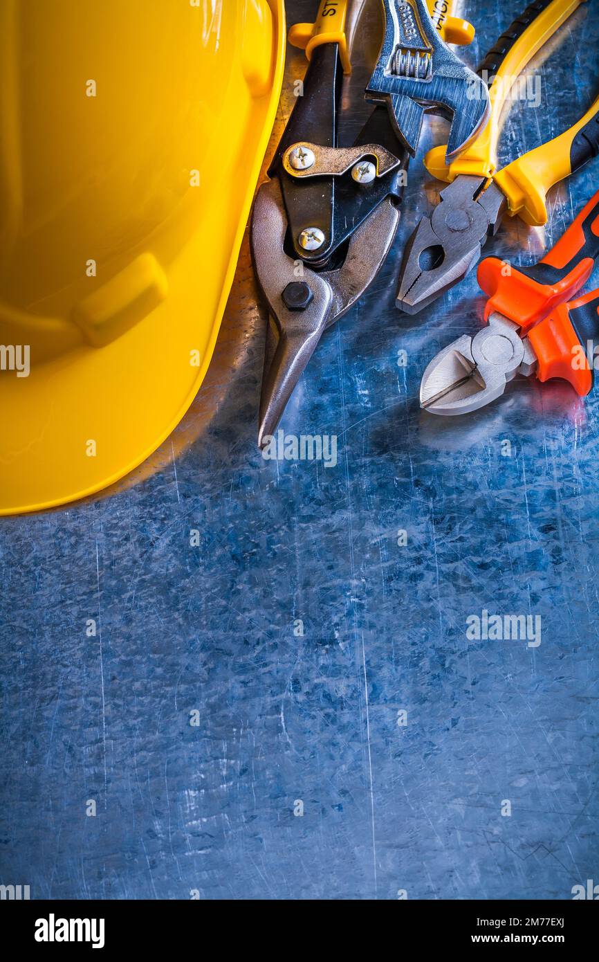 Scratched metallic background with group of repairing construction ...