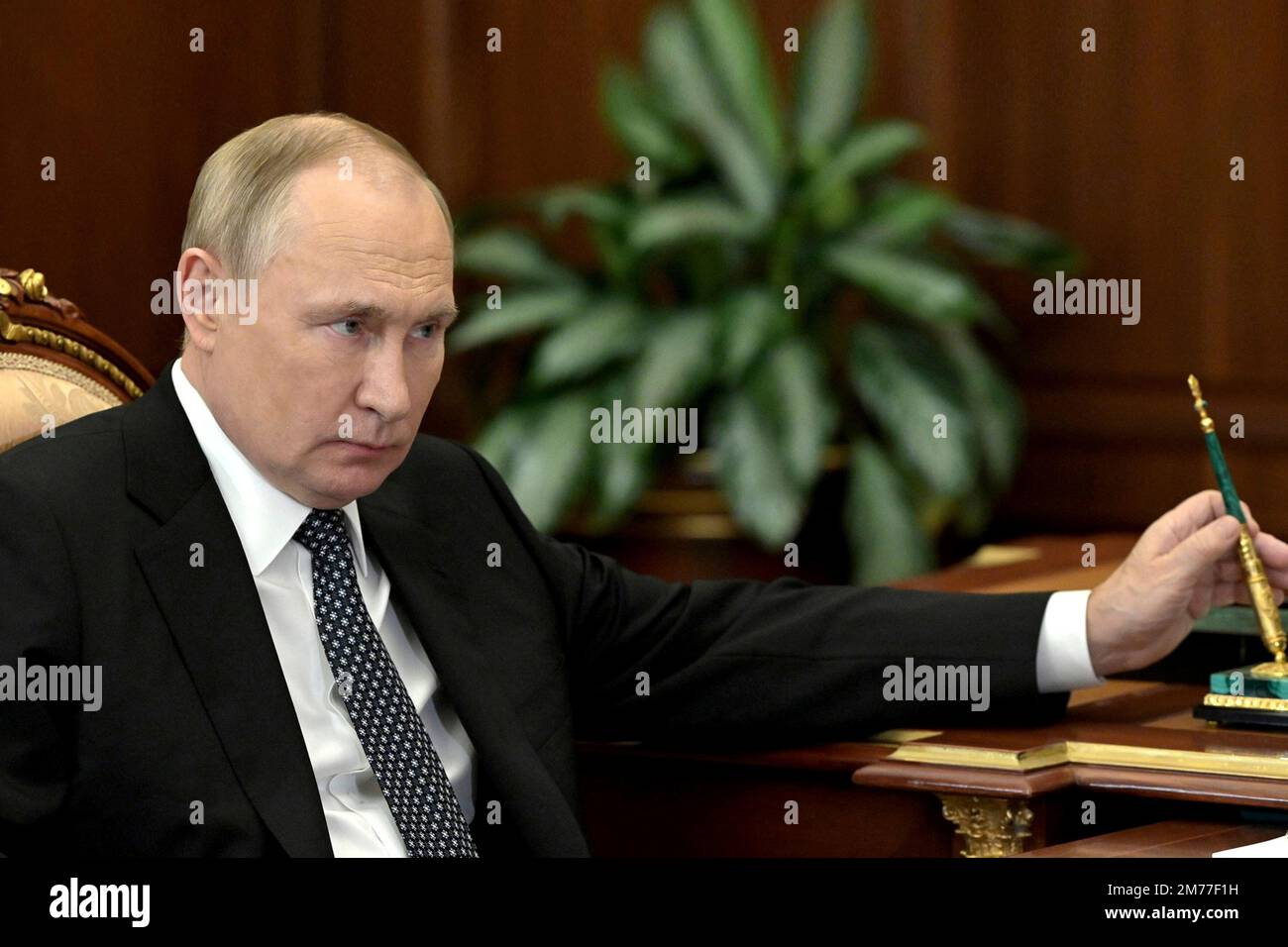 Vladimir PUTIN (President Russia) sits at the desk, single image, cut ...