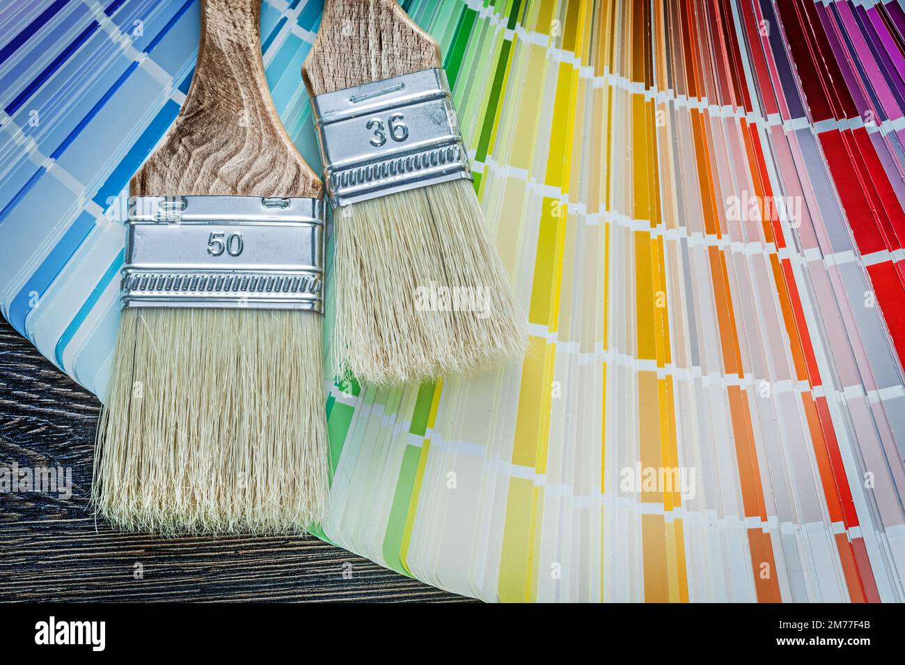 Set of color sampler paintbrushes on wooden board Stock Photo - Alamy