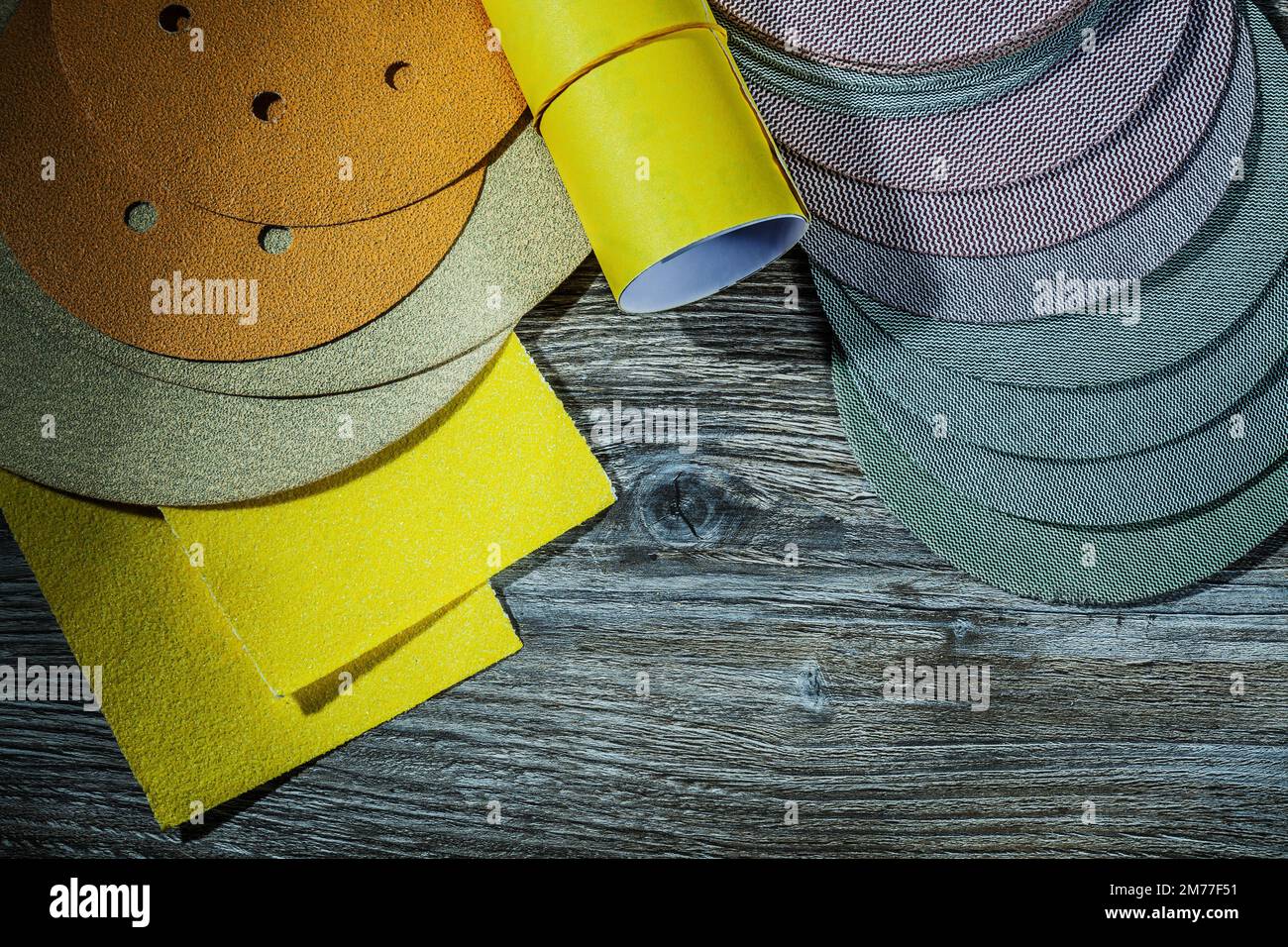 set of abrasive tools sanding discs and sandpaper on vintage wood Stock ...