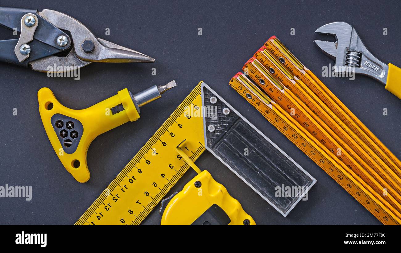 set of construction tools on black background Stock Photo - Alamy