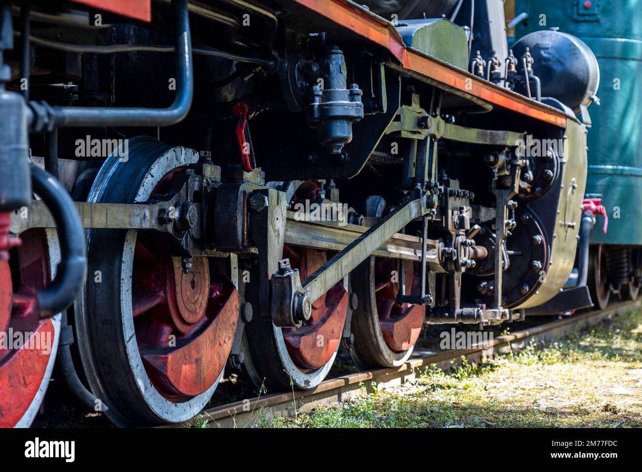 Close-up of the driving wheels of a steam locomotive. Steam locomotive ...