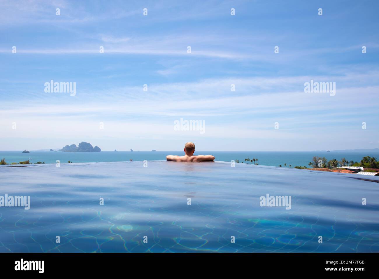 Male Resting In Infinity Pool At Aonang Cliff Beach Resort Stock Photo ...