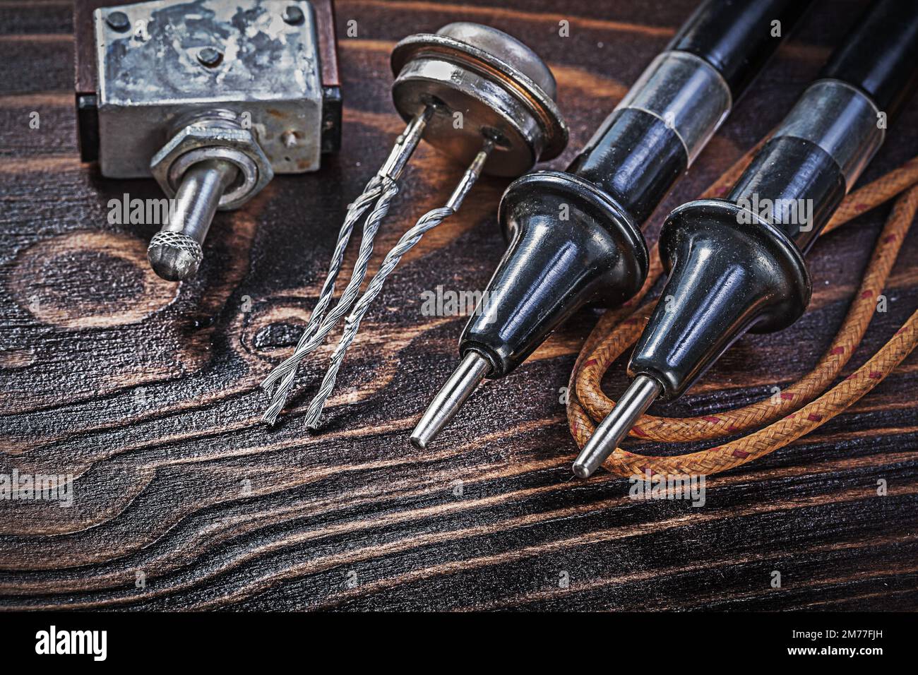 Set of vintage electric equipment on wooden board electricity concept ...