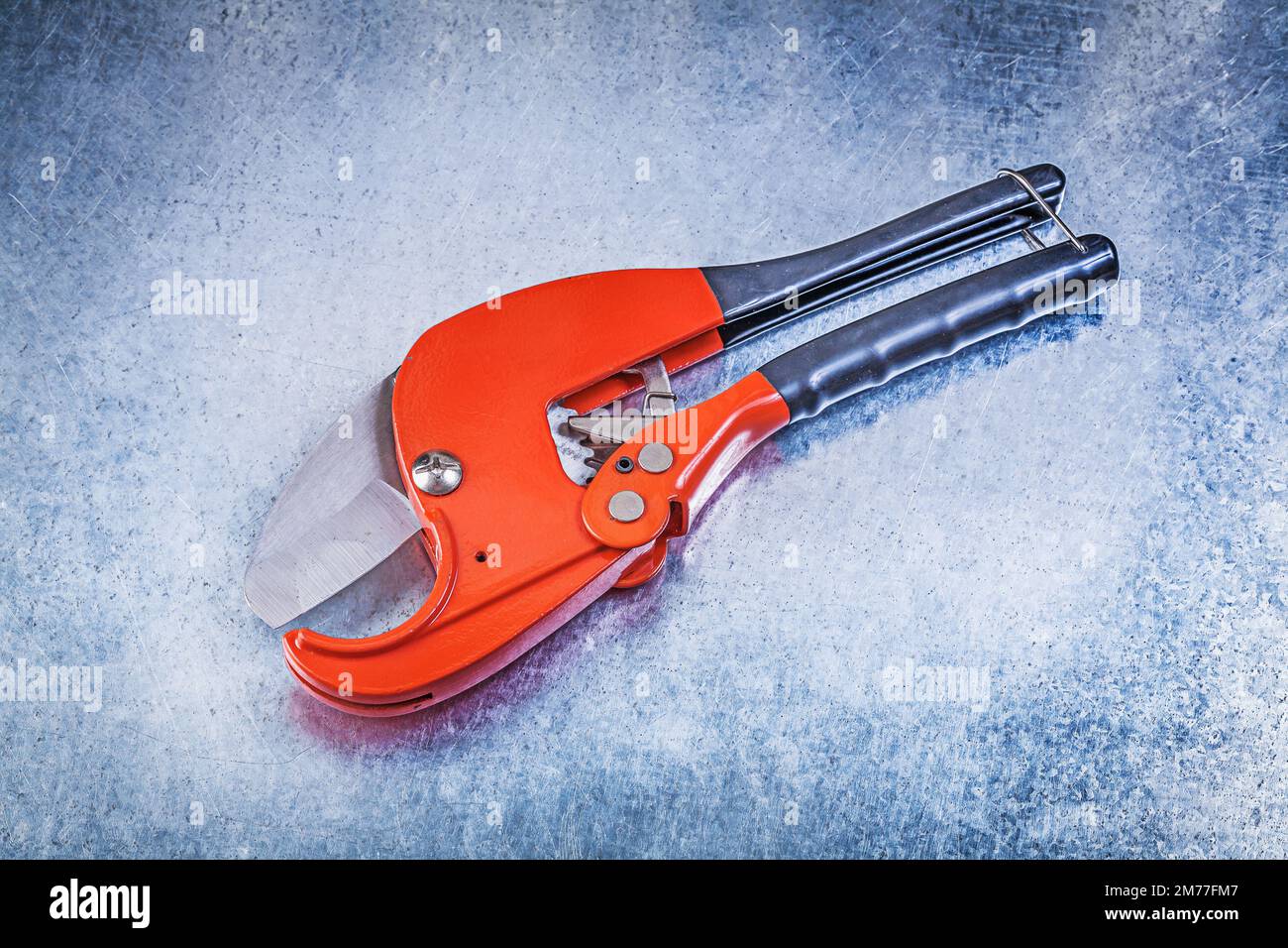 Sharp pipe cutter on metallic background construction concept Stock ...