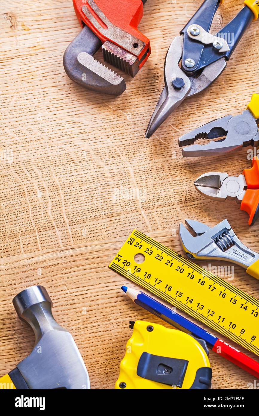 set of tools organized in copyspace hammer tapeline ruller pencil ...