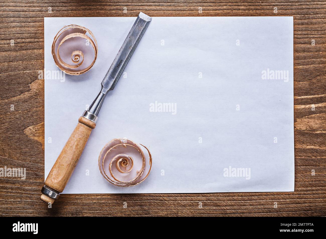 Sheet of paper curled shavings firmer chisels construction concept ...