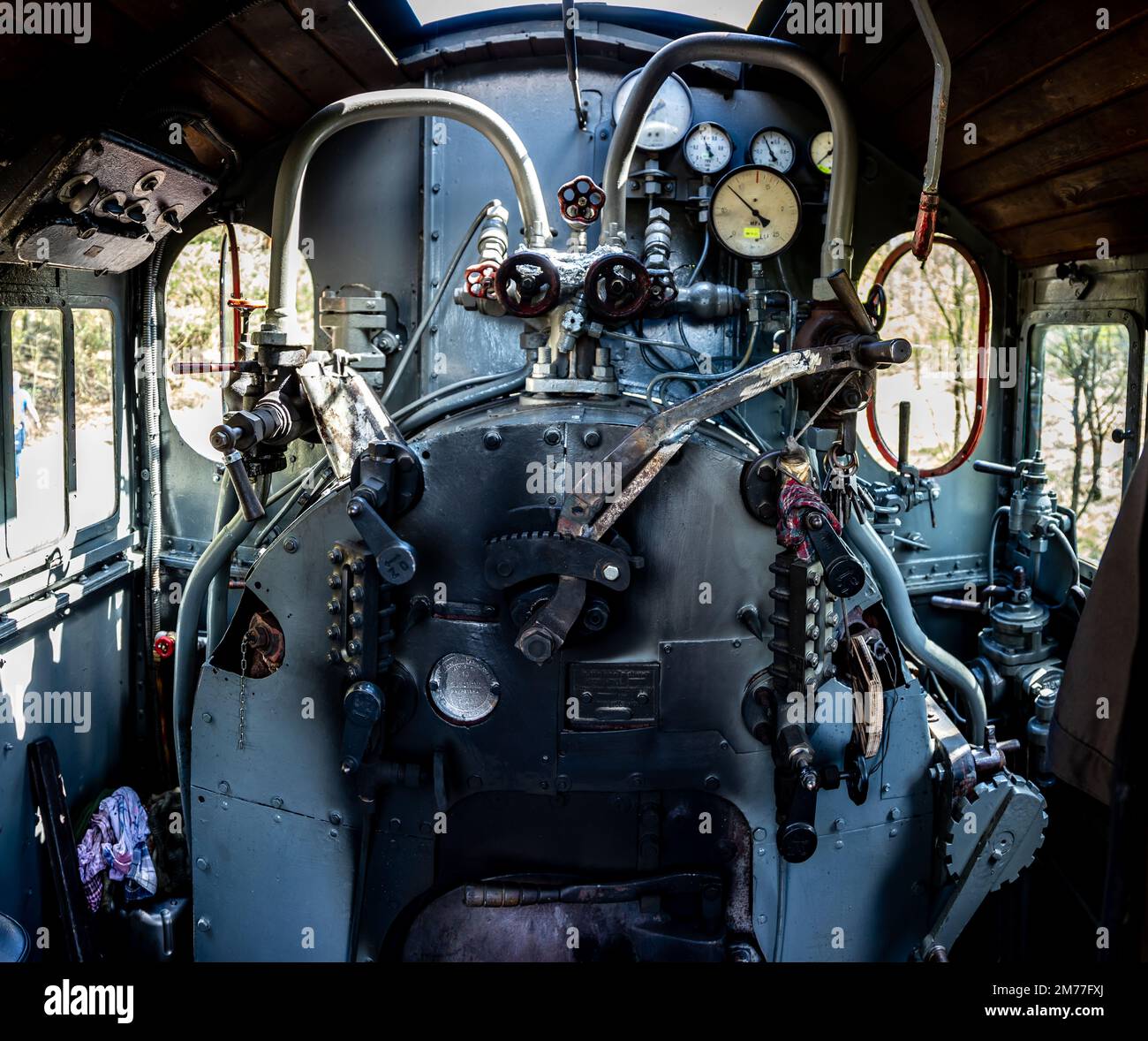 A set of pressure gauges and other gauges on a steam locomotive boiler ...
