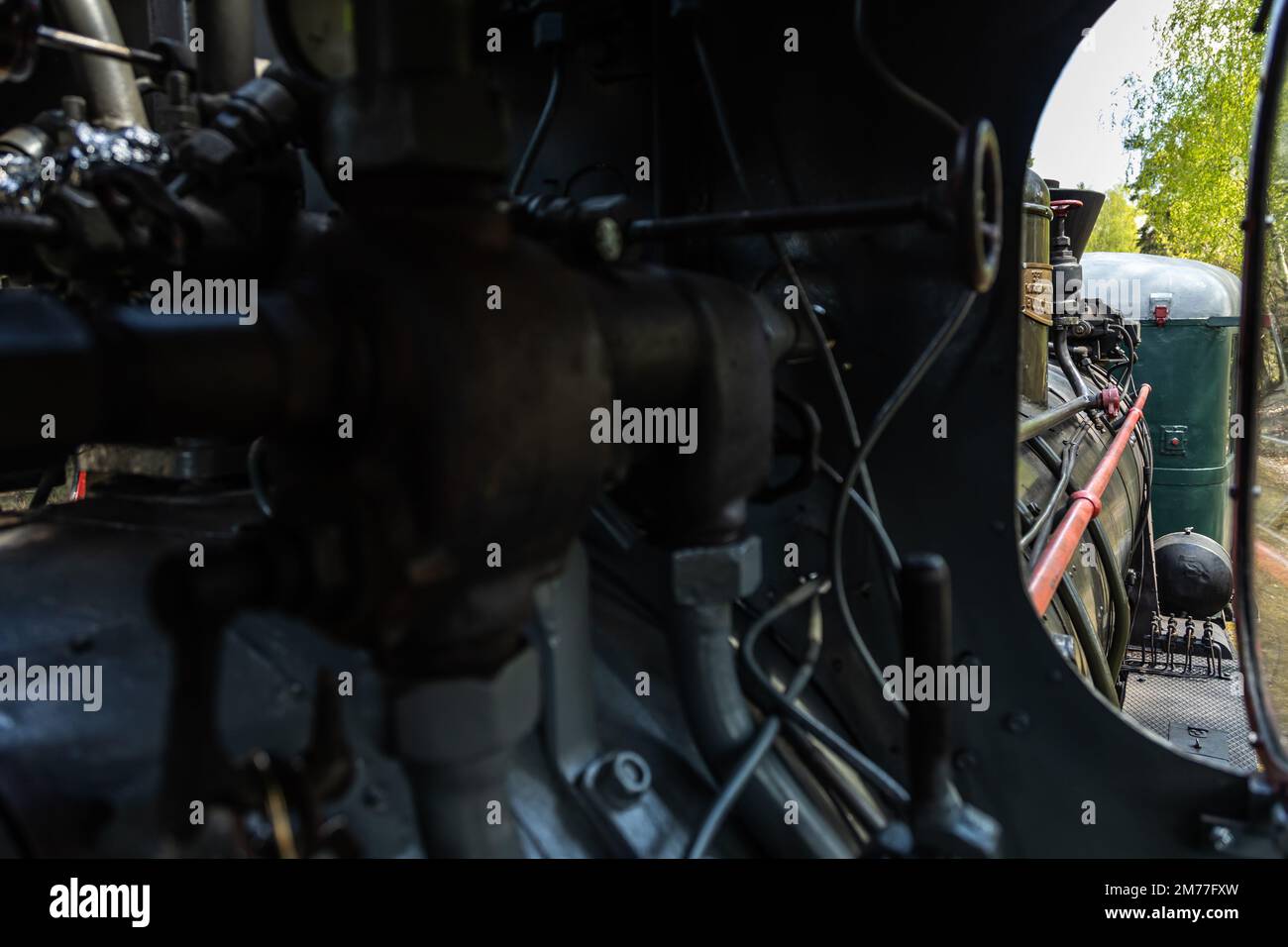 A set of pressure gauges and other gauges on a steam locomotive boiler ...