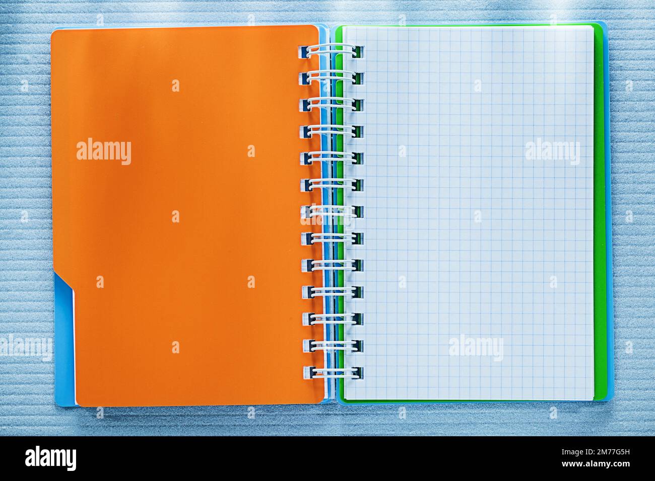 Spiral checked notebook directly above Stock Photo - Alamy