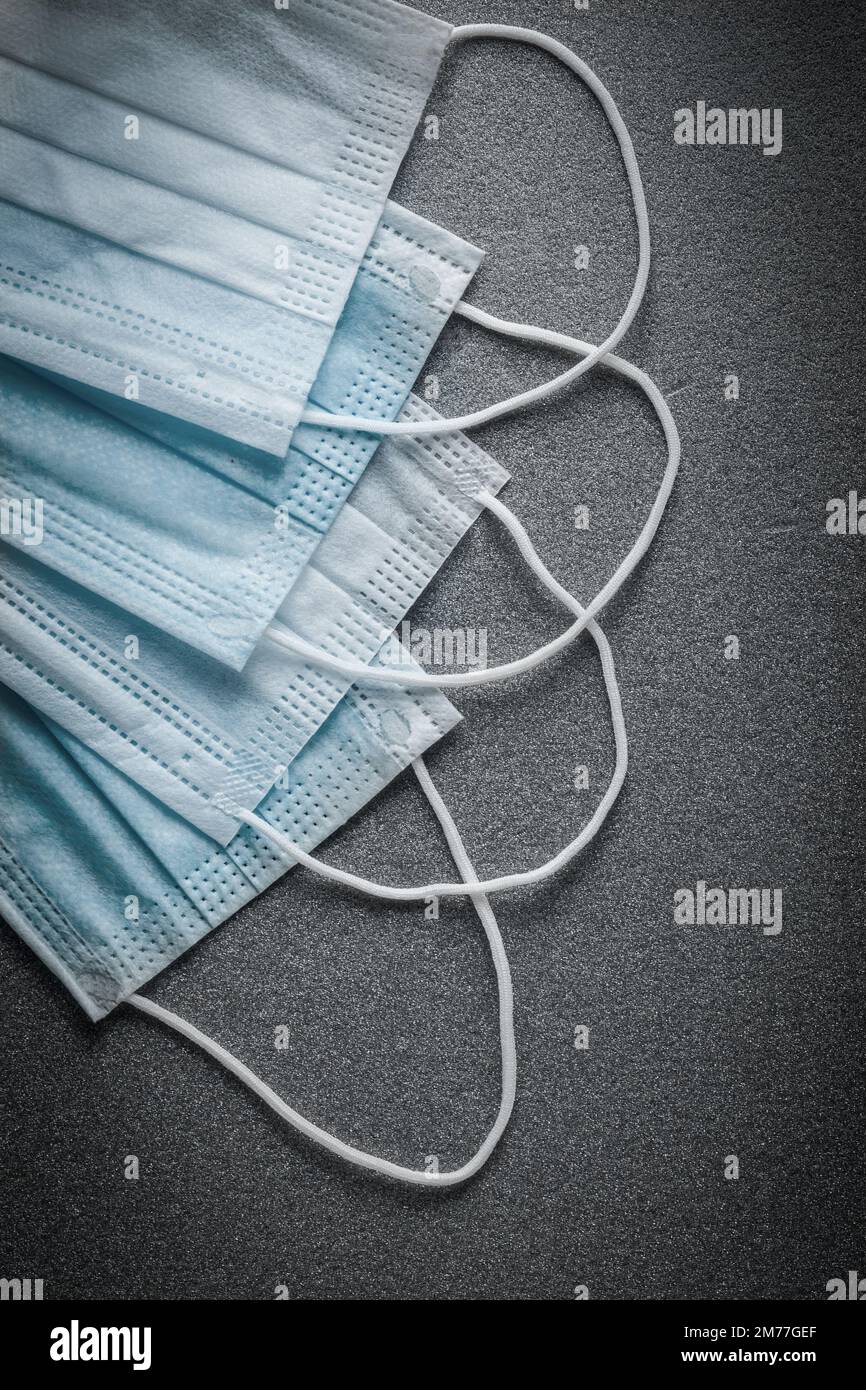 Sterile surgical masks on grey background Stock Photo - Alamy