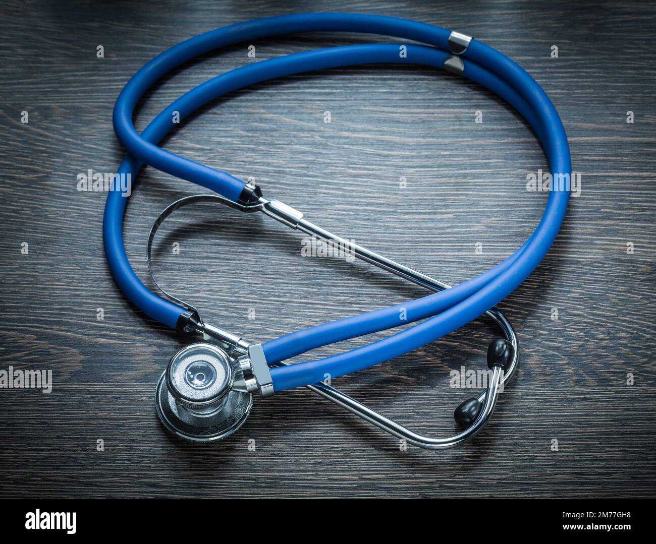 Stethoscope on vintage wooden board horizontal image Stock Photo - Alamy