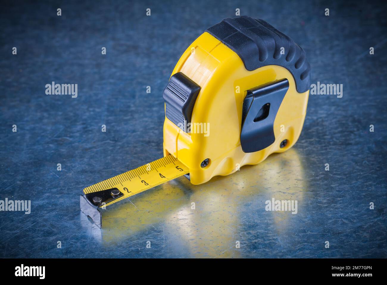 Tape measure on scratched vintage metallic background construction ...