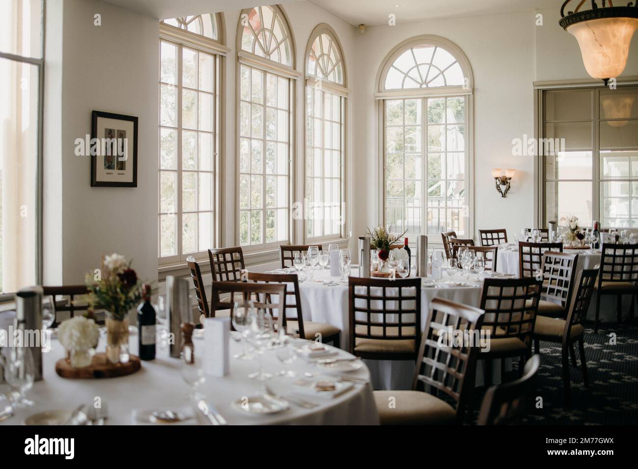 A beautiful hall with empty tables ready for a wedding event Stock ...