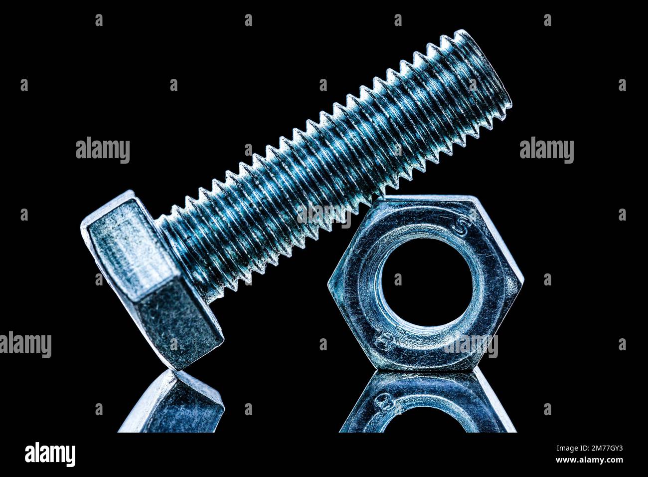 Threaded construction nut bolt on black background Stock Photo - Alamy