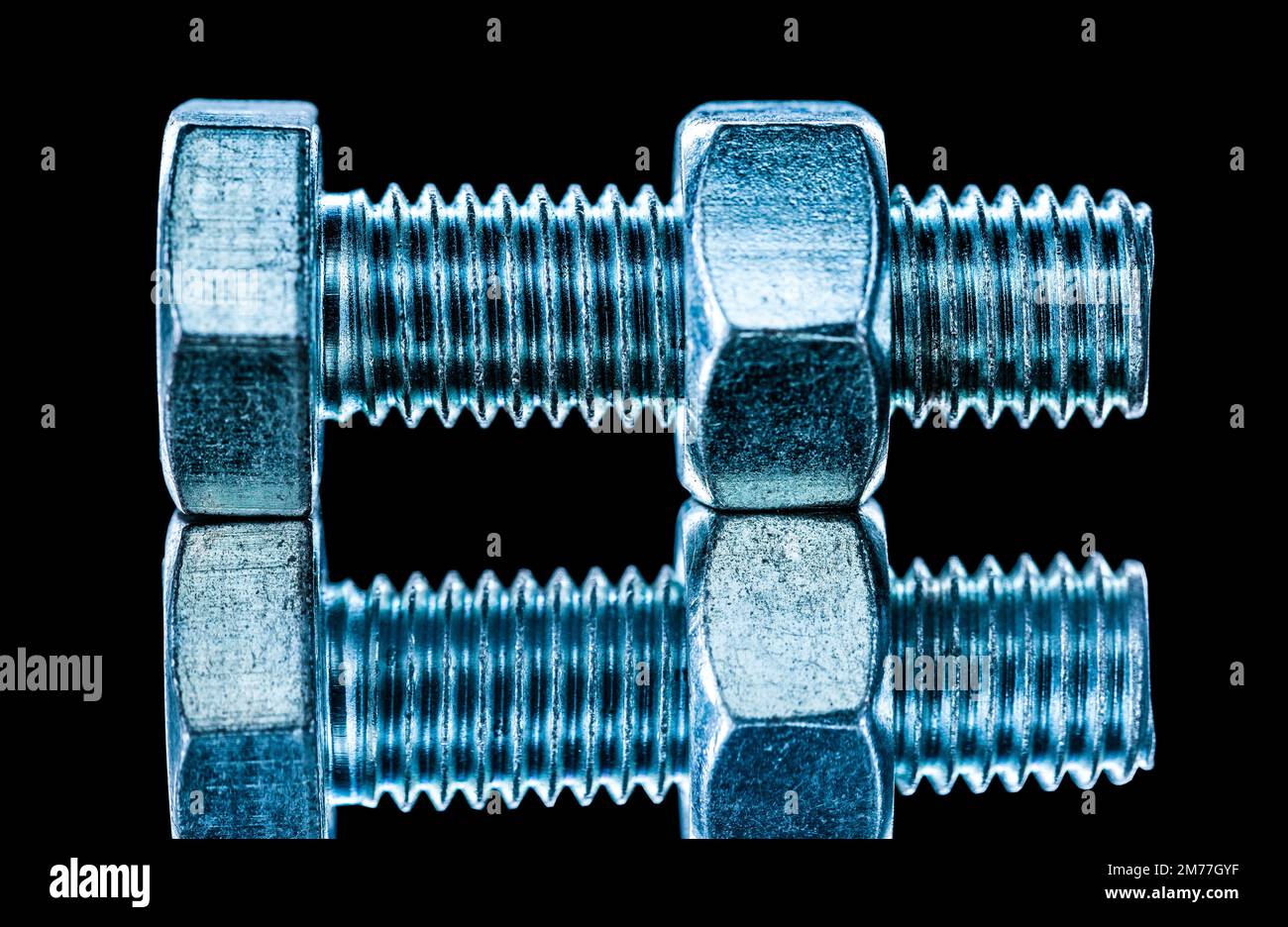 Threaded construction nut screwbolt on black background Stock Photo - Alamy