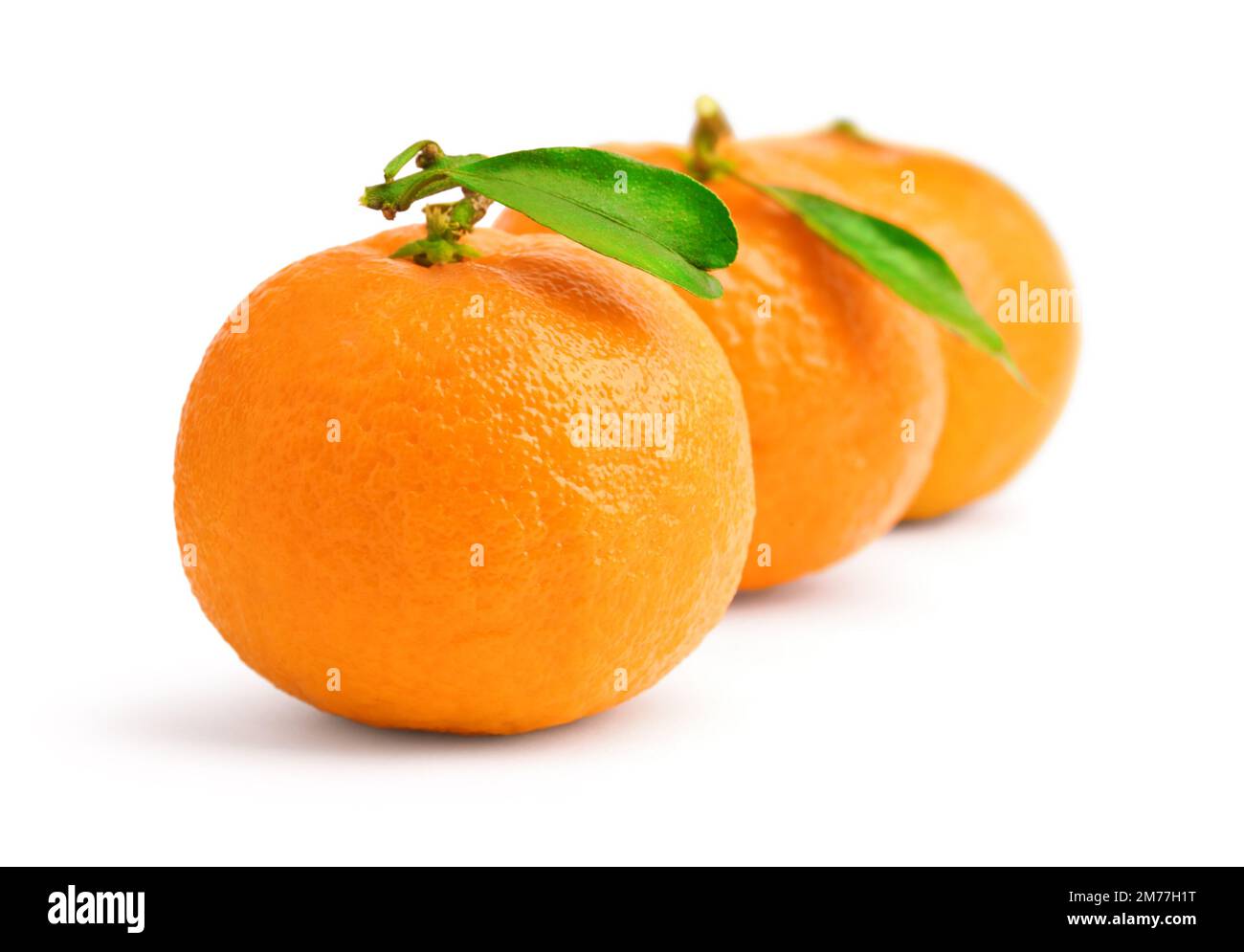 three tangerine isolated Stock Photo - Alamy