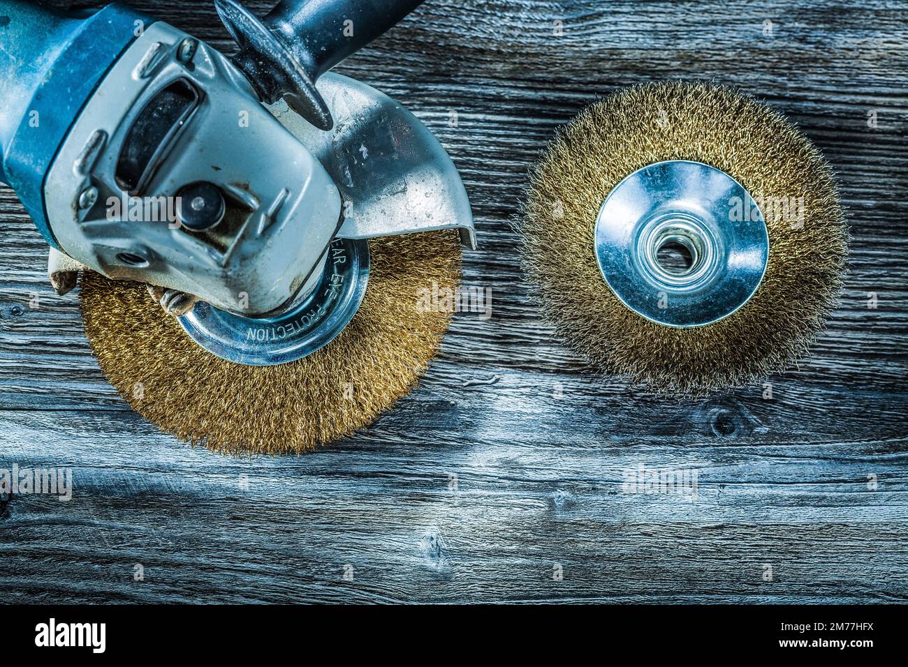 Used rotary wire brushes on vintage wooden board top view Stock Photo ...
