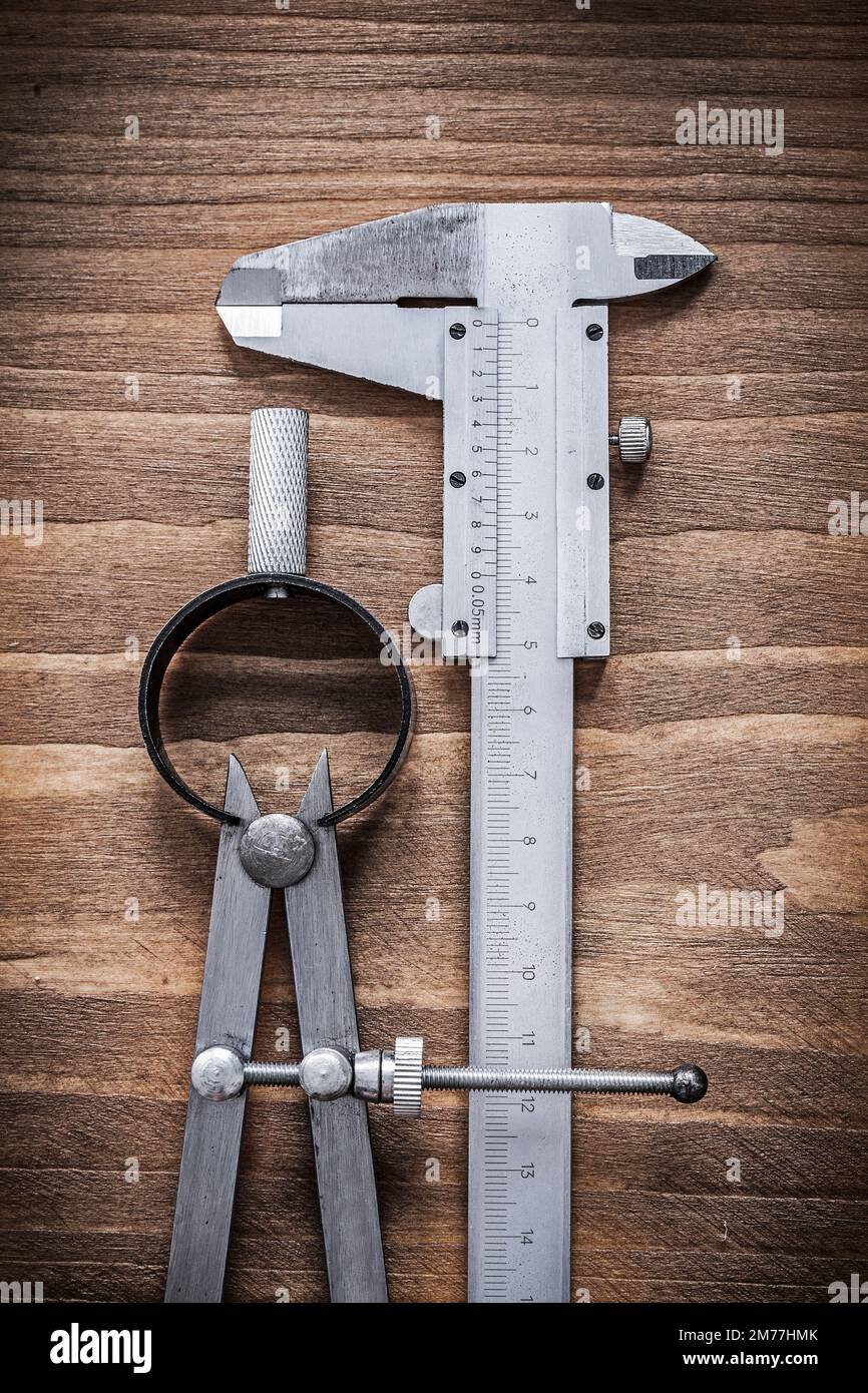 Vernier scale divider on wooden board construction concept Stock Photo ...