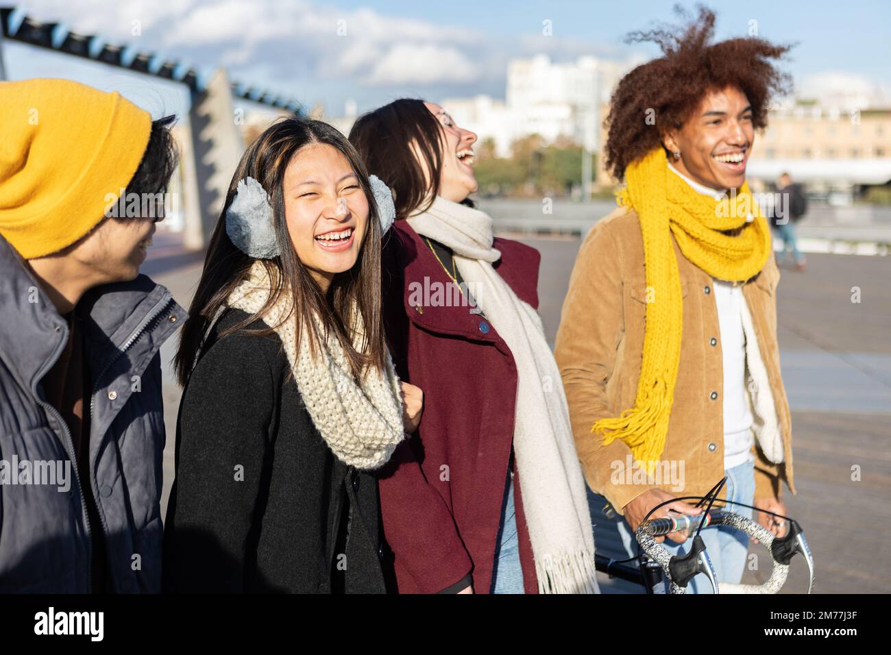 Multiracial group of young friends having fun outside in the city Stock ...