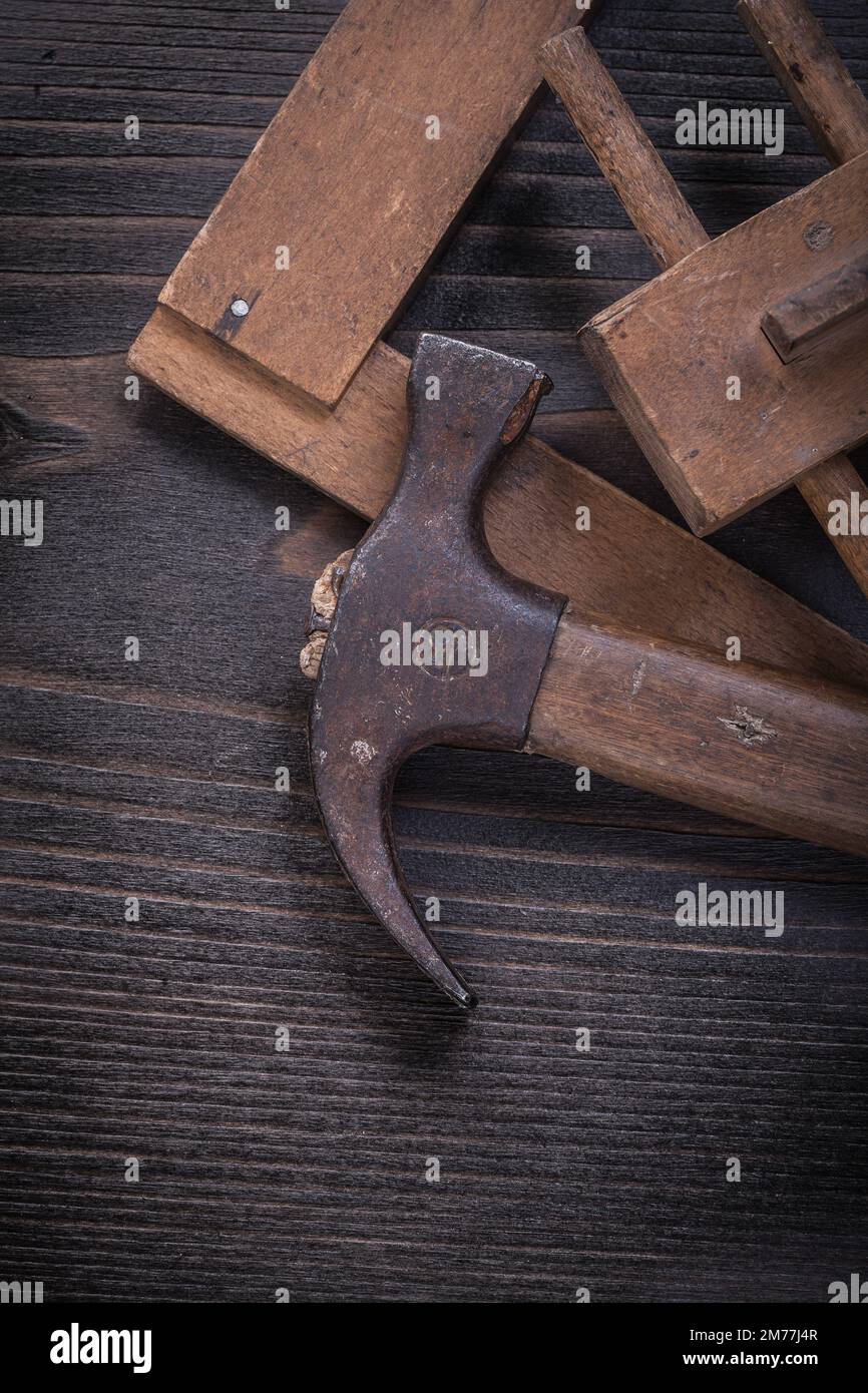 Vintage claw hammer square ruler marking gage on wood board Stock Photo ...