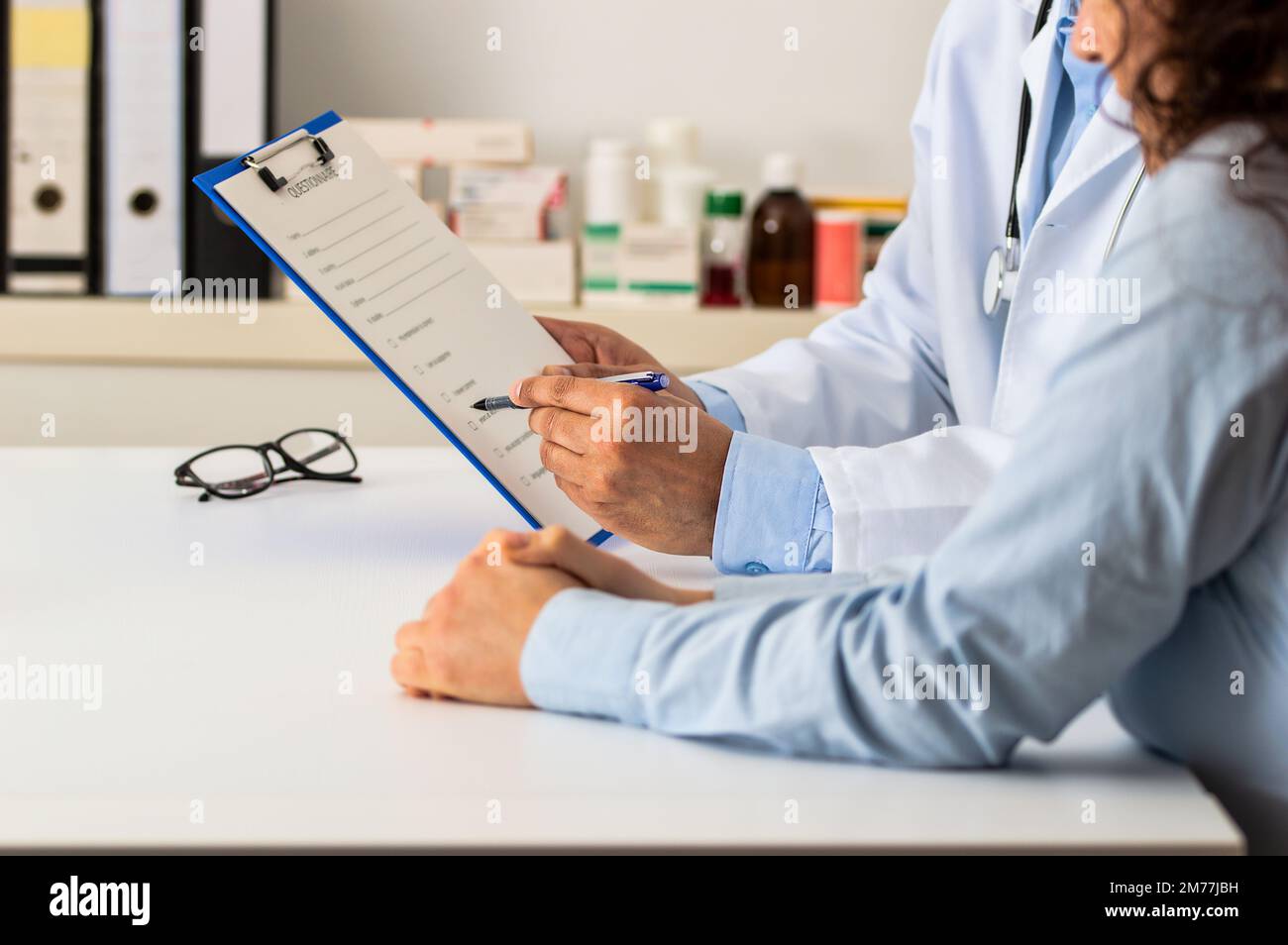 Doctor prescribing medicine during medical hi-res stock photography and ...