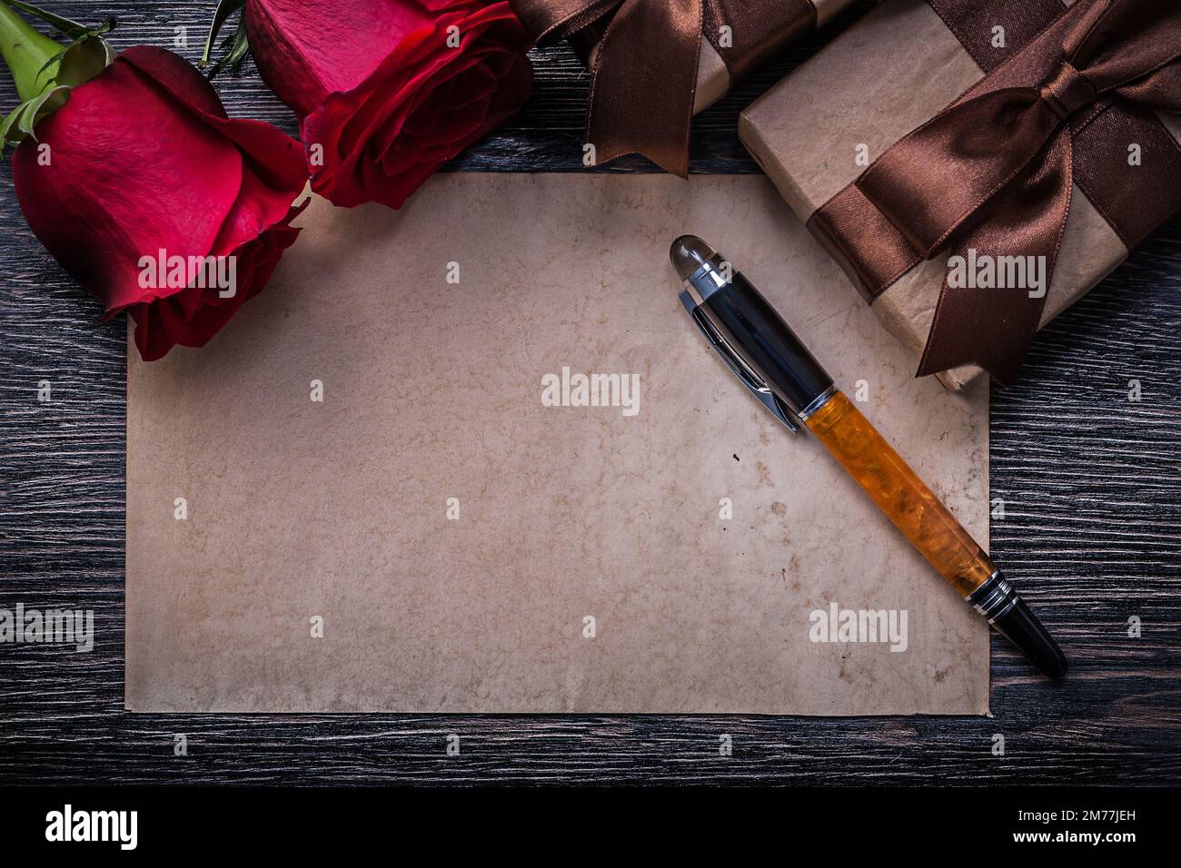 Vintage paper red roses gift boxes fountain pen Stock Photo - Alamy