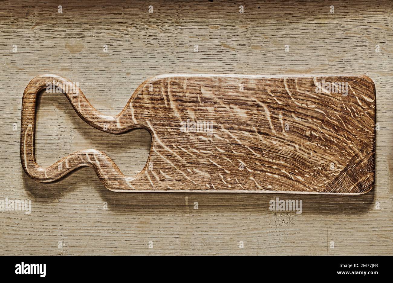 vintage oak wood serving board on wooden background Stock Photo - Alamy