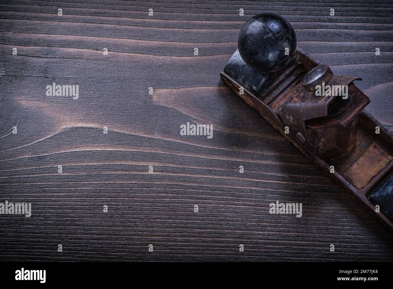 Vintage rusty shaving plane on wooden board construction concept Stock ...