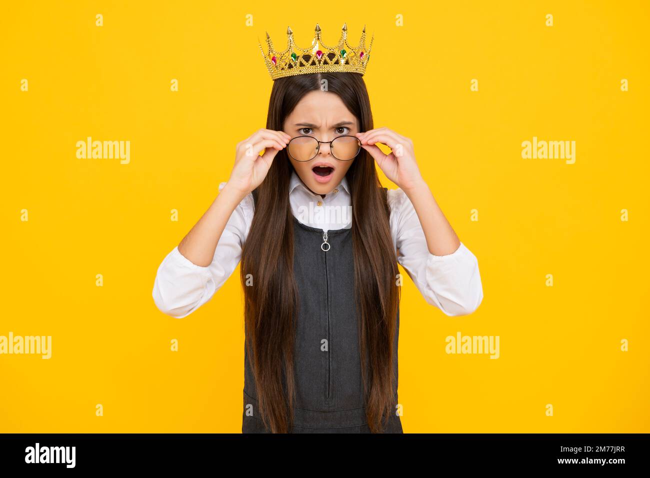 Girls birthday party, funny kid in crown. Imagine herself a queen ...