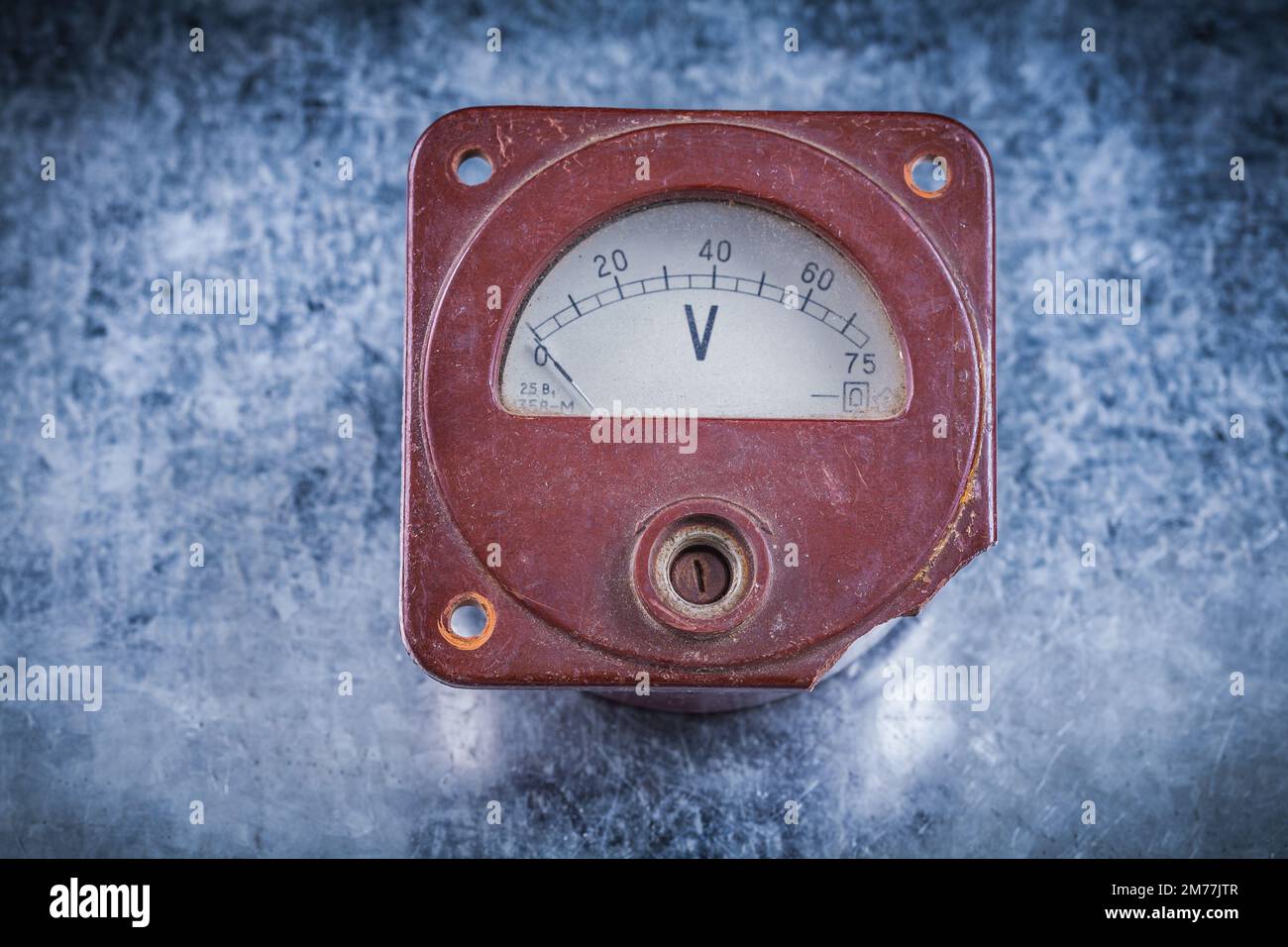 Voltmeter on scratched metallic background vintage electricity concept ...