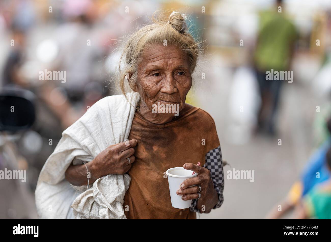 Poor woman walking hi-res stock photography and images - Alamy