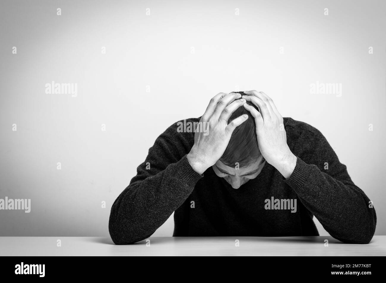 Lonely man sitting Black and White Stock Photos & Images - Alamy